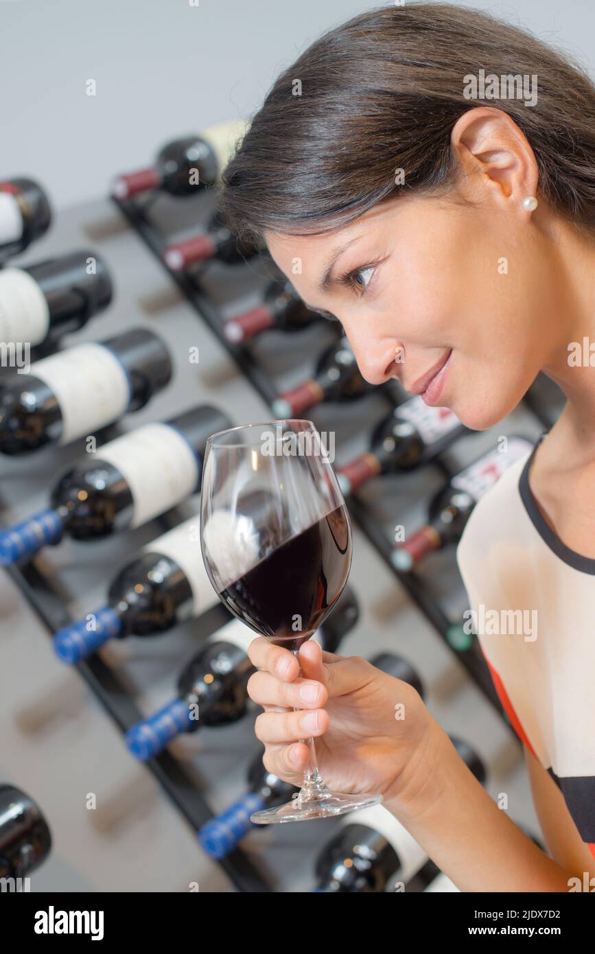 a tipsy woman drinking wine Stock Photo - Alamy