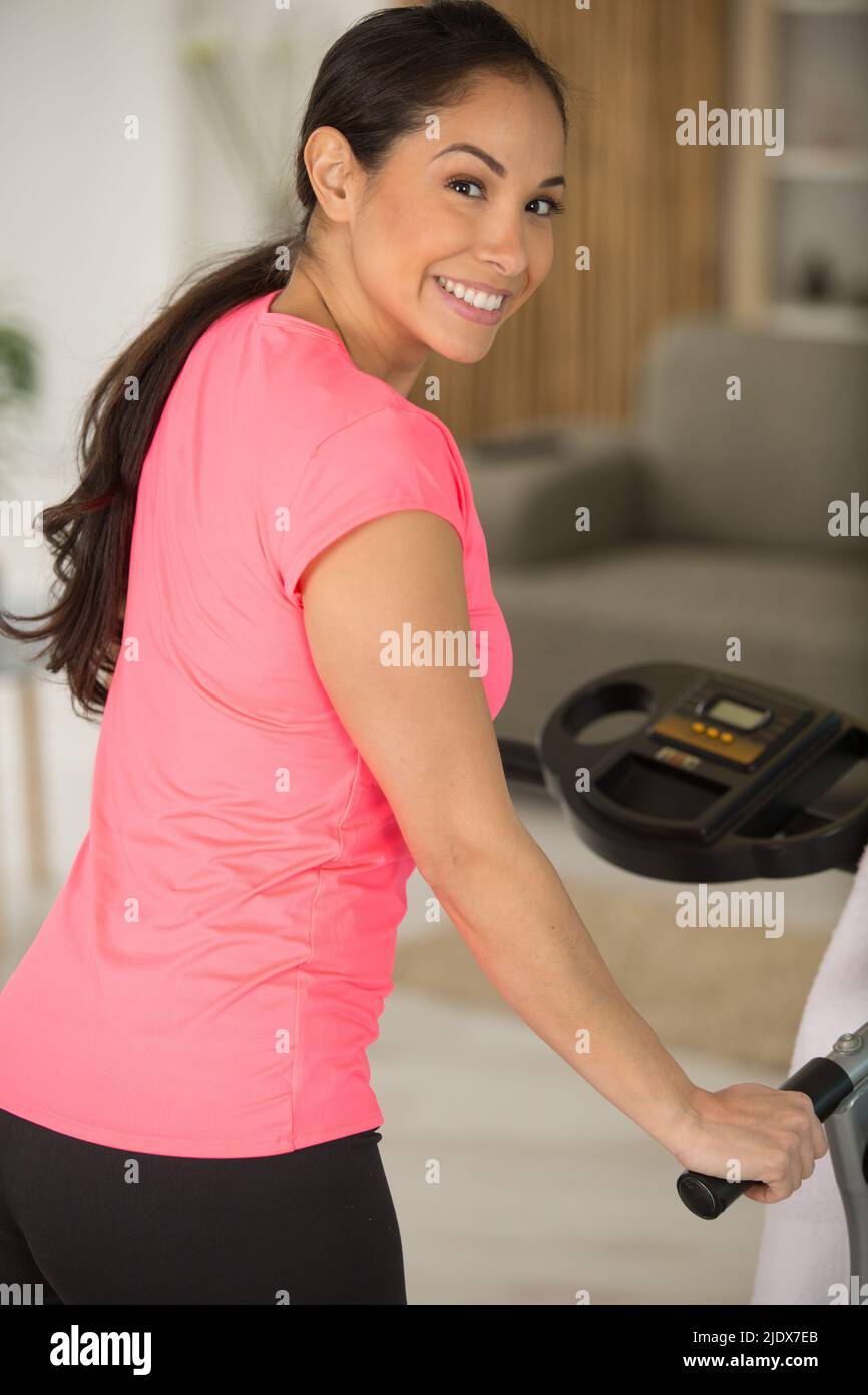 happy woman visiting gym on regular basis Stock Photo - Alamy