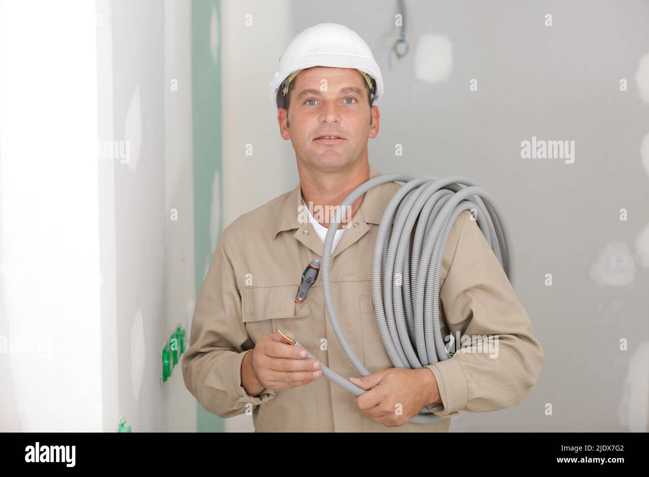 a man doing electrical repairs Stock Photo - Alamy