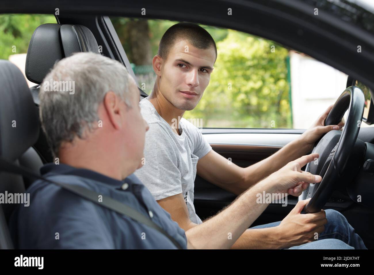 father teaching his son to drive Stock Photo - Alamy