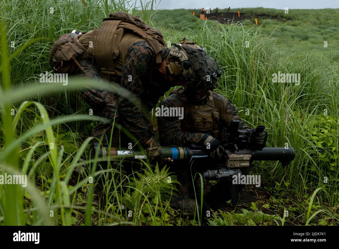 U.S. Marines with 3d Battalion, 2d Marines load an MK 153 Shoulder ...