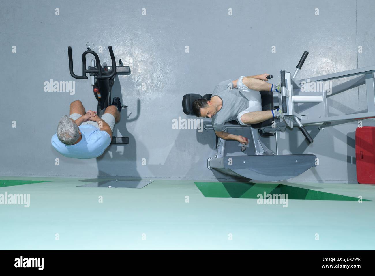 men on exercise equipment seen from above Stock Photo - Alamy