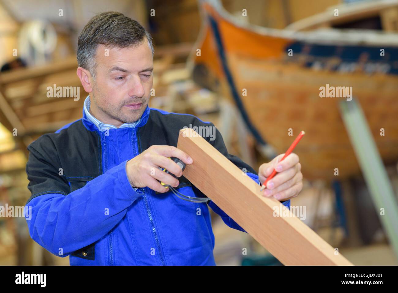 a man is building putting a mark Stock Photo - Alamy