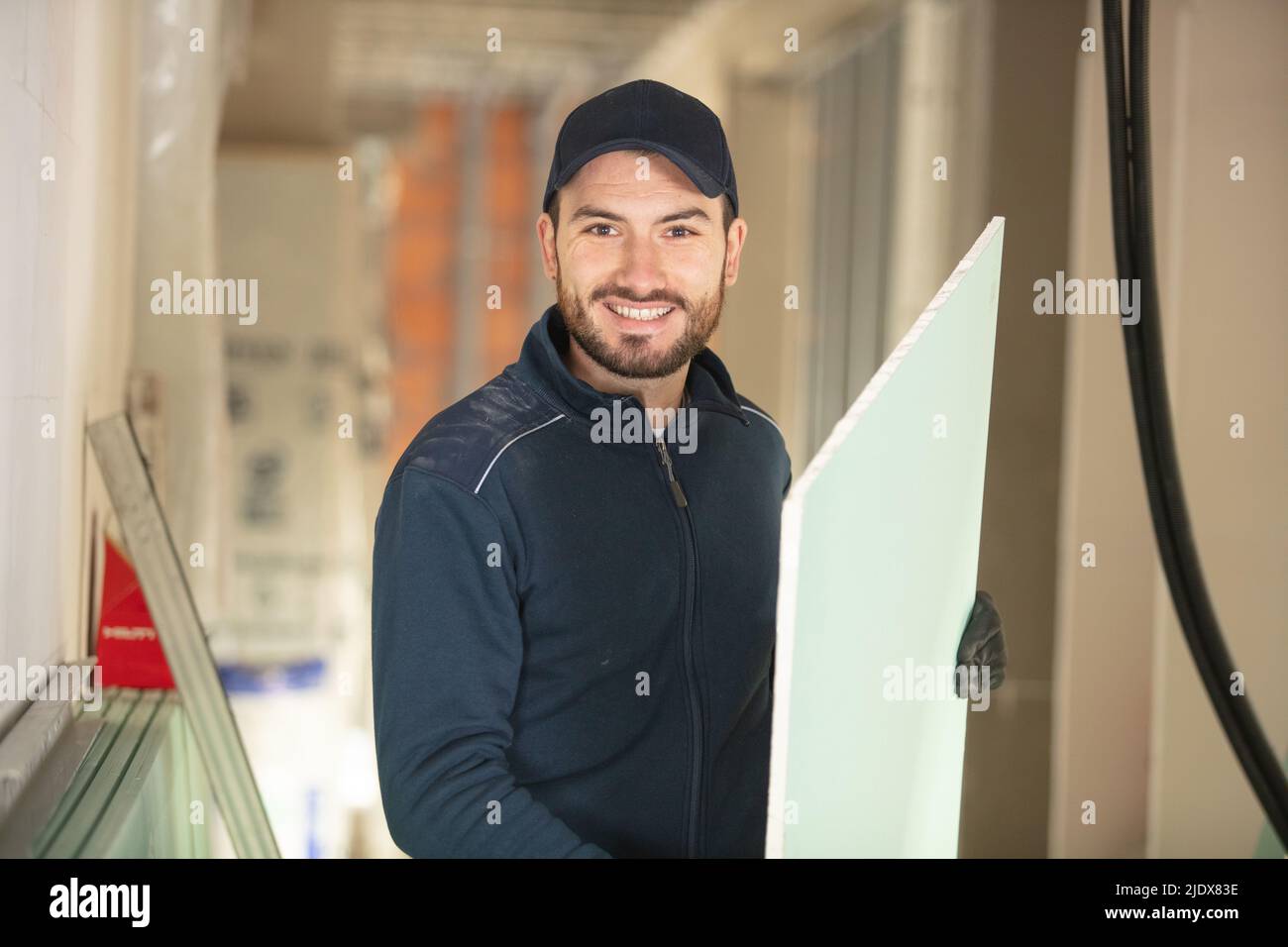 line electrician builder engineer worker at indoor construction site ...