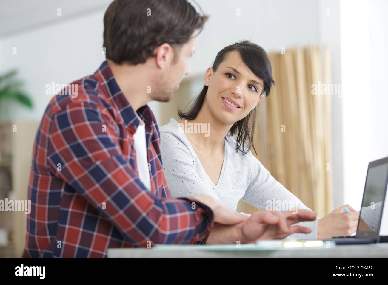 young husband and wife doing paperwork together Stock Photo - Alamy