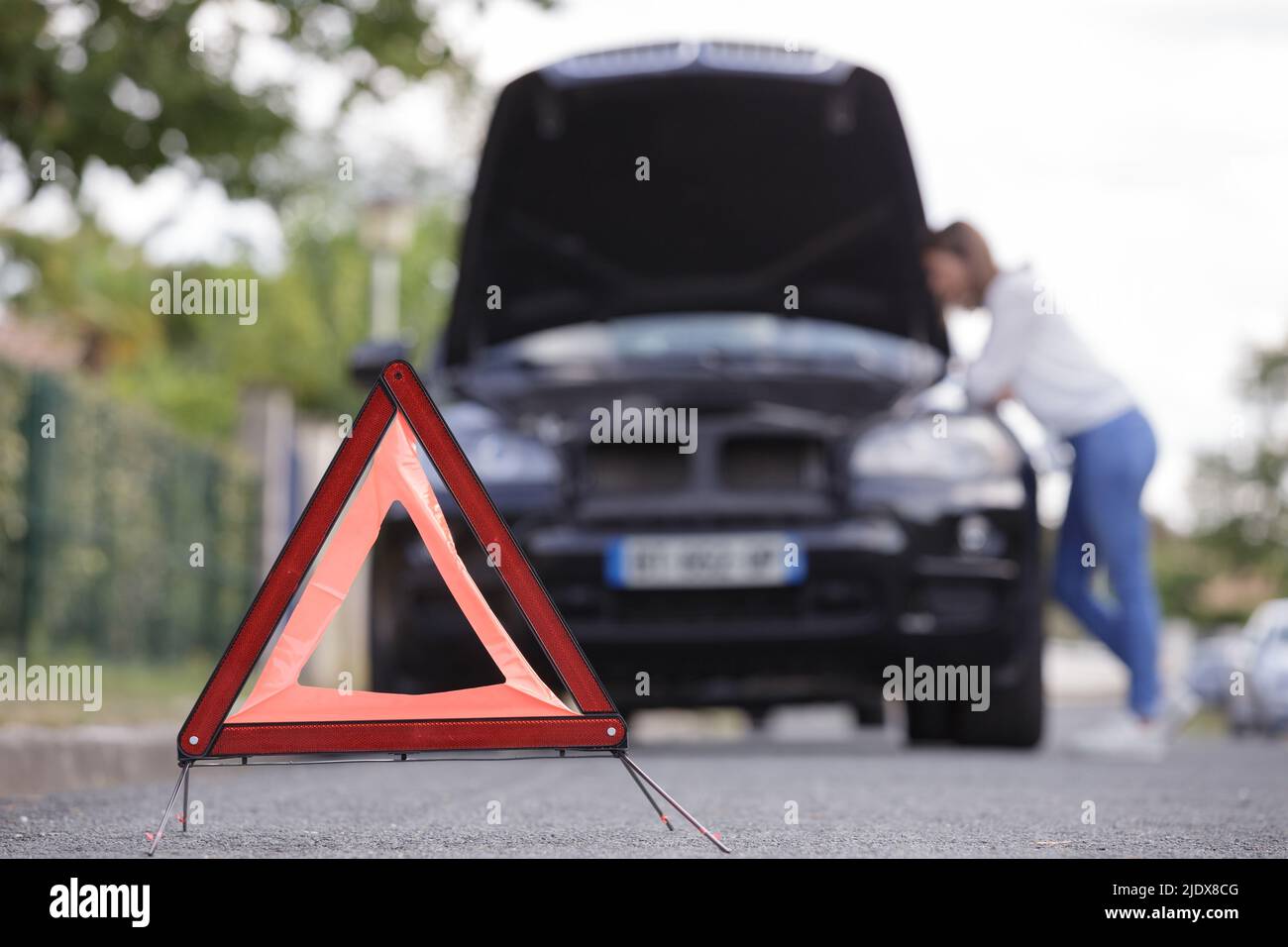 a breakdown triangle on the road Stock Photo - Alamy
