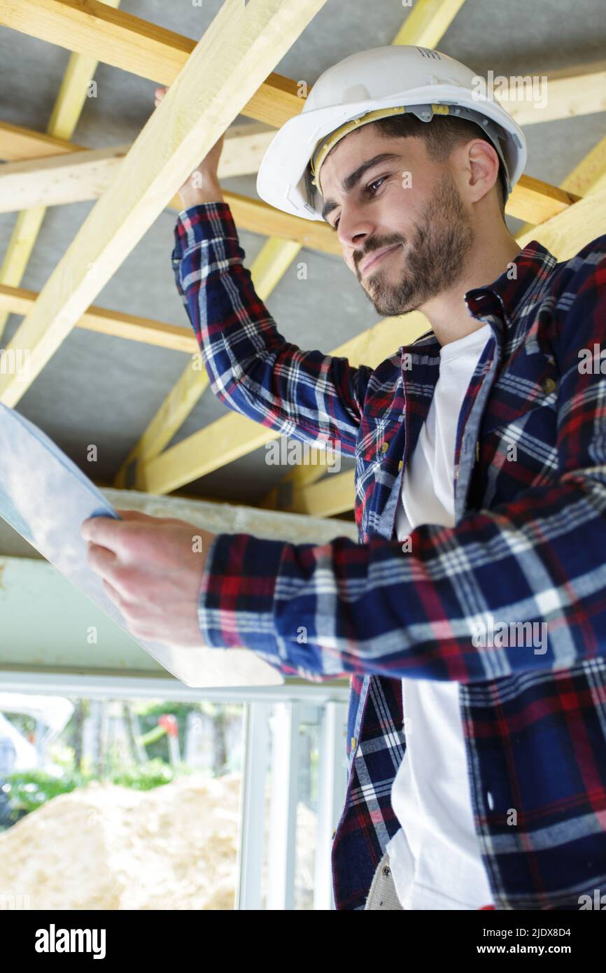 Man working on a ladder hi-res stock photography and images - Alamy