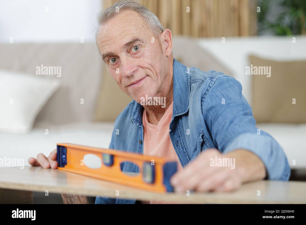assembling furniture with a level Stock Photo - Alamy