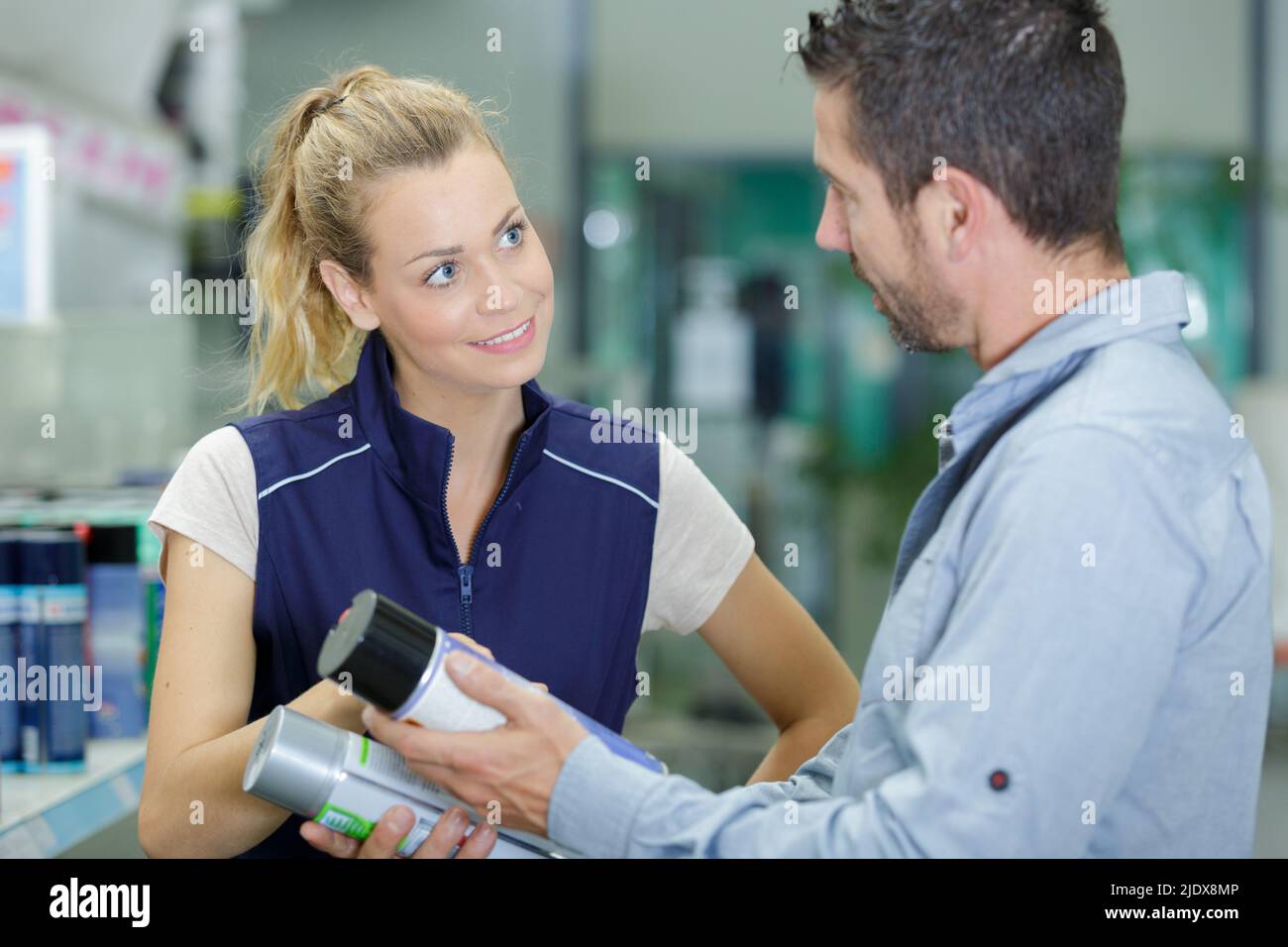 male customer buying spray paint can in the supermarket Stock Photo - Alamy