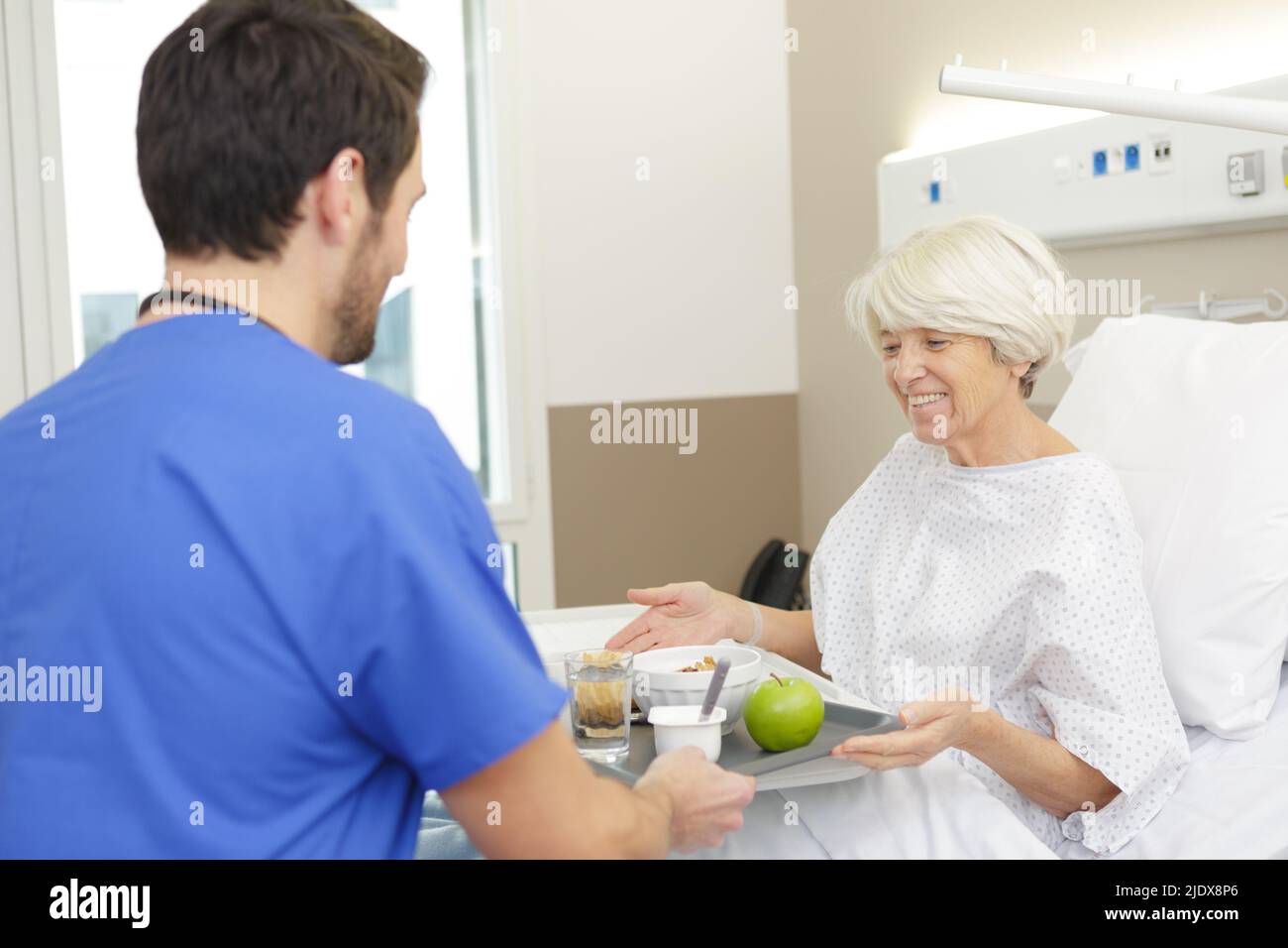 lady woman patient being served breakfast in hospital Stock Photo - Alamy