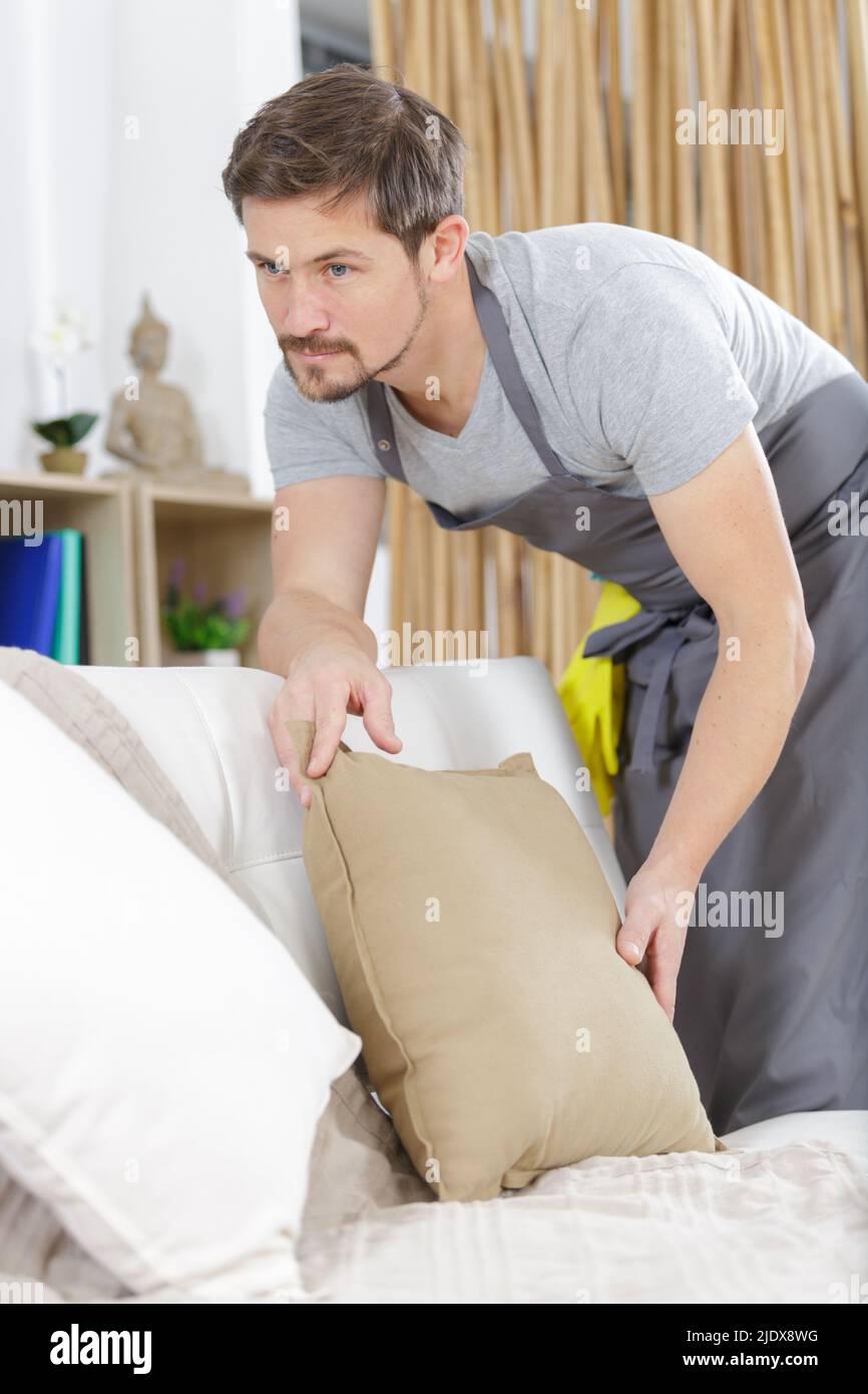 man in uniform cleaning flat Stock Photo - Alamy