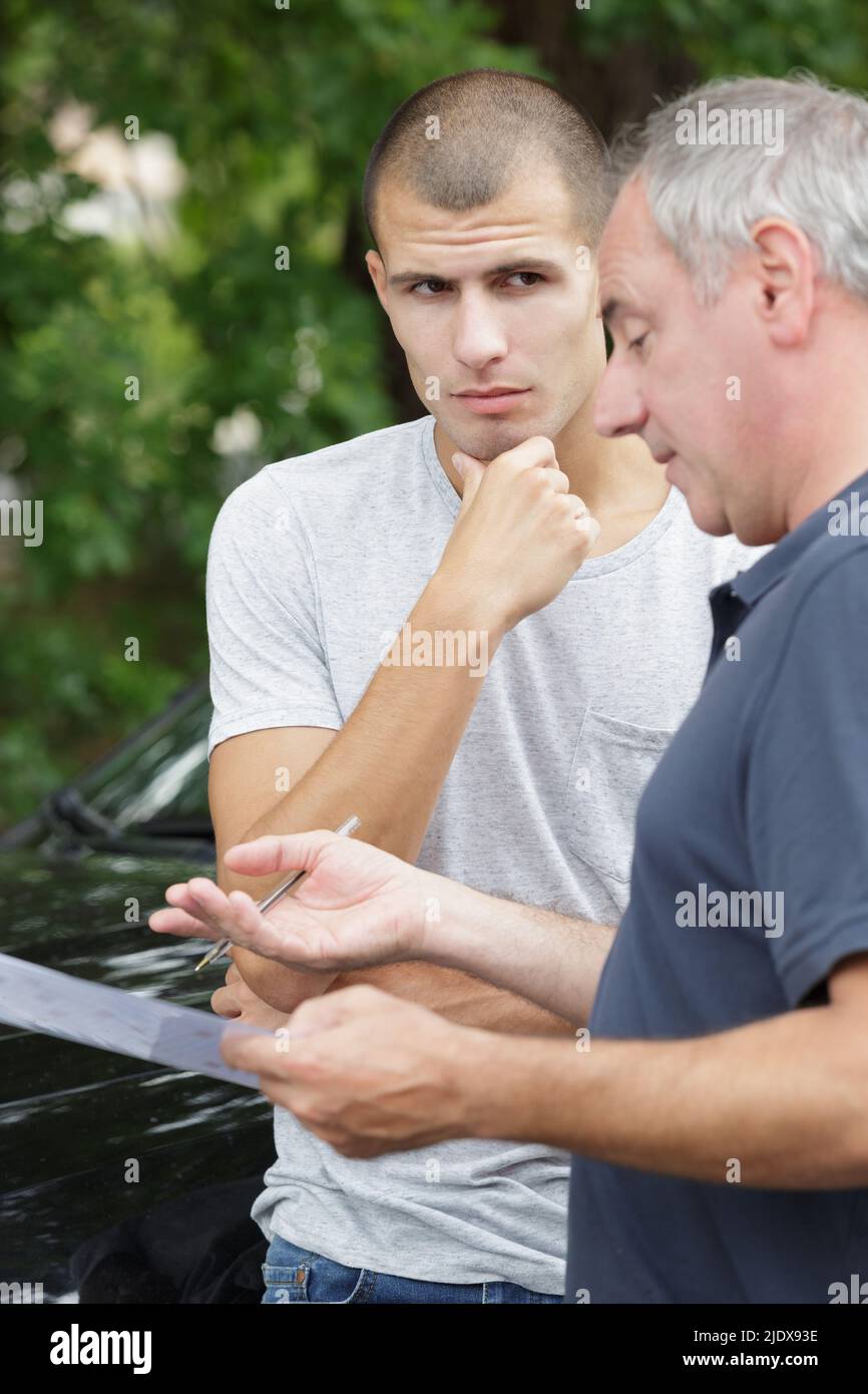 instructor of driving school giving exam Stock Photo - Alamy