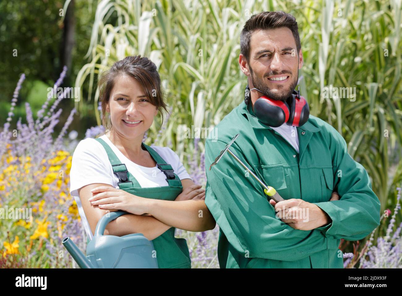 Couple gardeners planting flowers hi-res stock photography and images ...