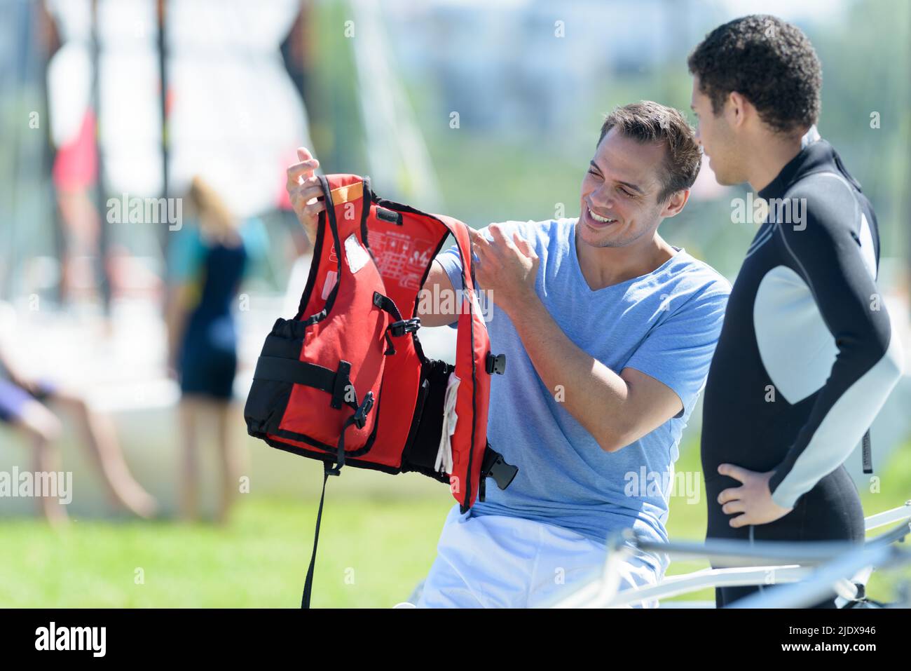 Surfer with life vest hi-res stock photography and images - Alamy