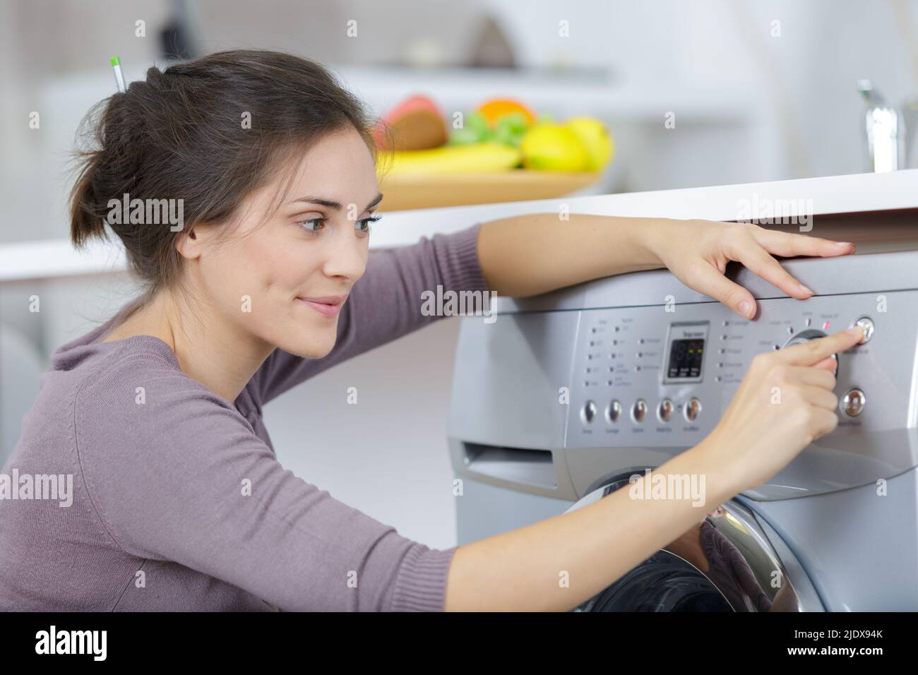 woman doing a washing machine Stock Photo - Alamy