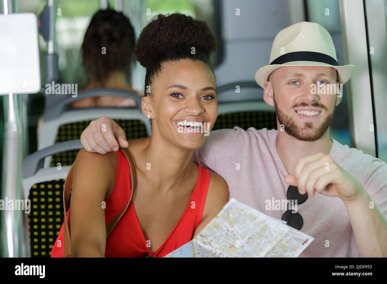 happy young couple in the bus Stock Photo - Alamy