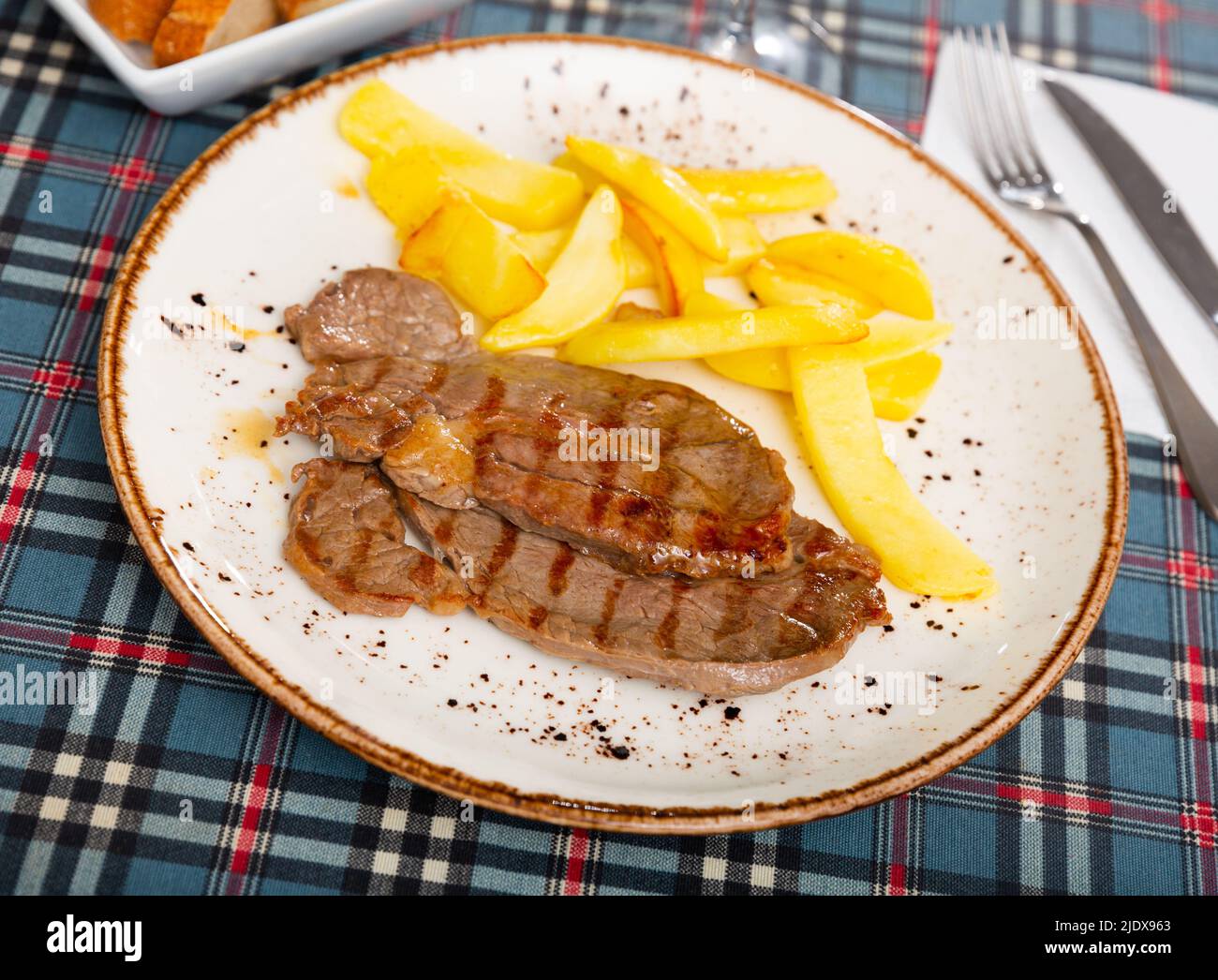 Traditional spanish grilled beef with potato Stock Photo - Alamy
