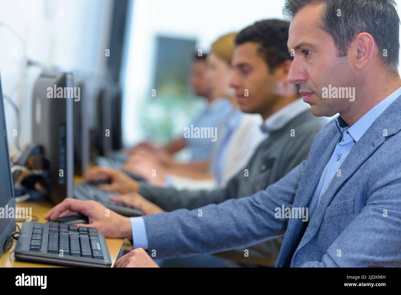 men sitting in the control room Stock Photo - Alamy