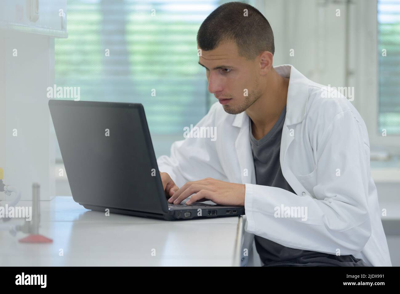 man student working in chemical lab on experiment Stock Photo - Alamy