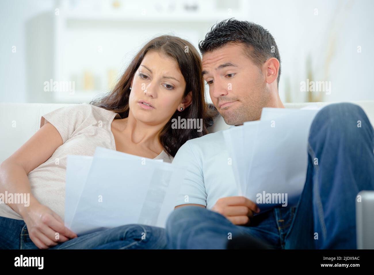 worried and stressed couple at home Stock Photo - Alamy