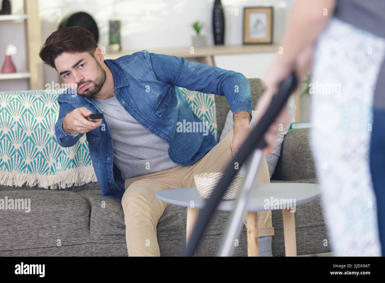 couple arguing over watching tv Stock Photo - Alamy
