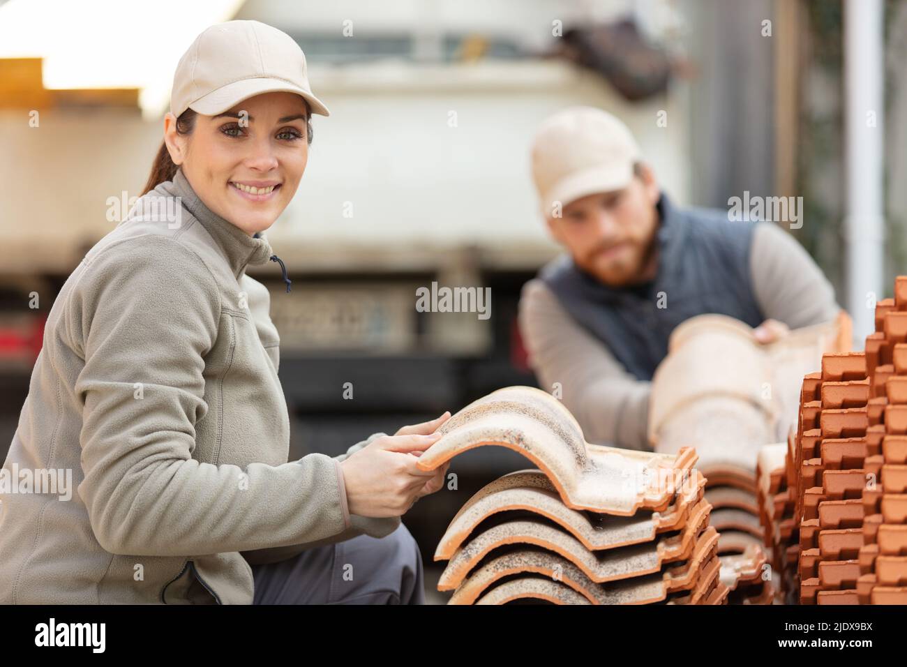 Slate tile fixing hammer roof hi-res stock photography and images - Alamy
