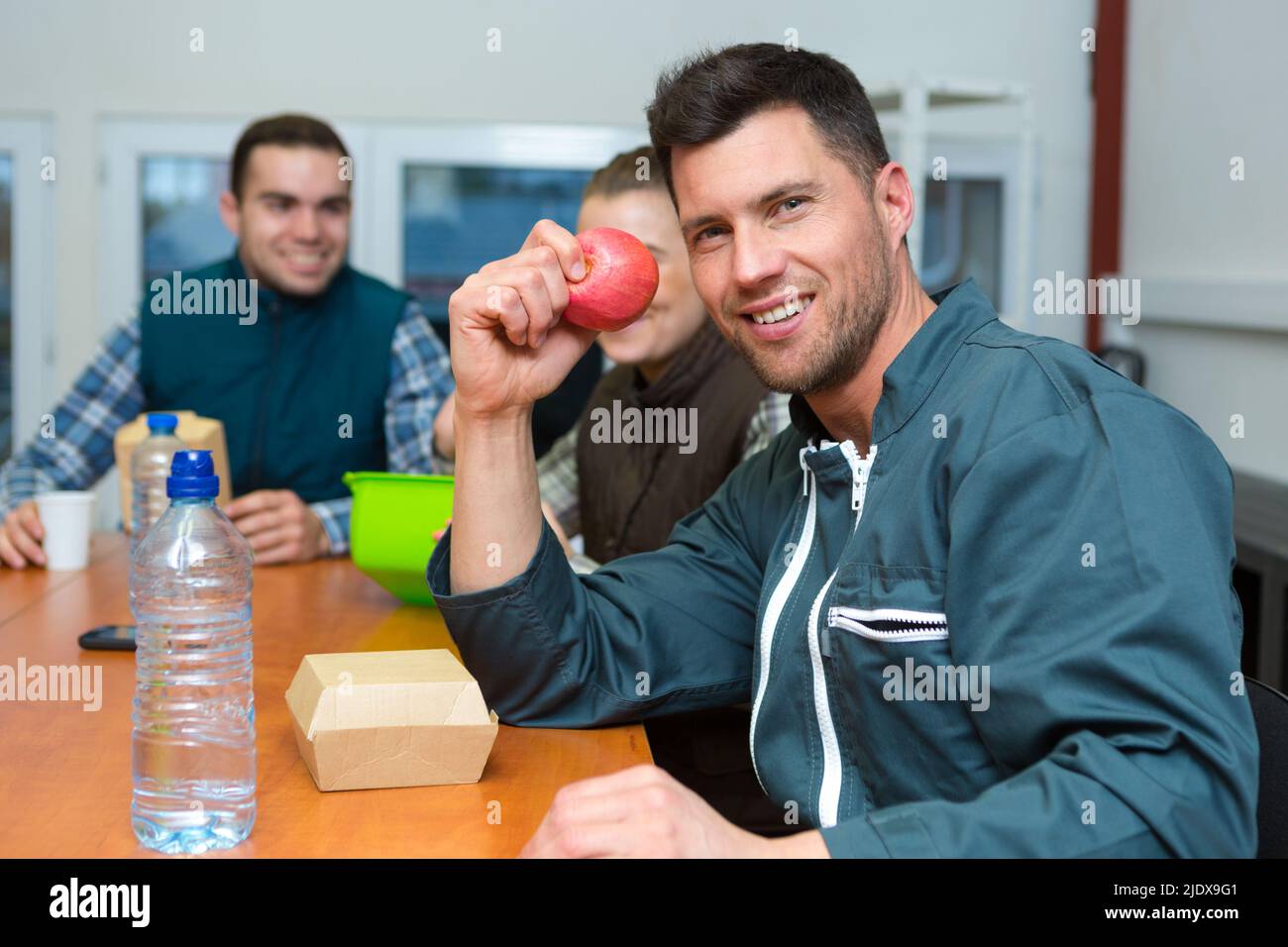 work team having lunch break Stock Photo - Alamy