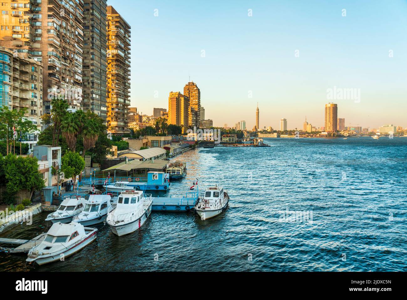 Egypt, Giza Governorate, Giza, Motorboats moored in front of apartments ...