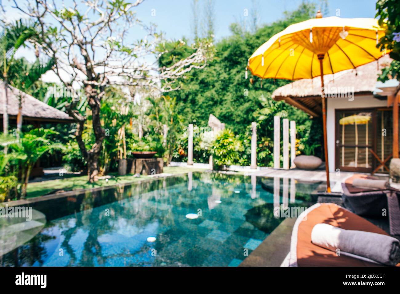 Indonesia, Bali, Defocused view of poolside of luxurious villa in ...
