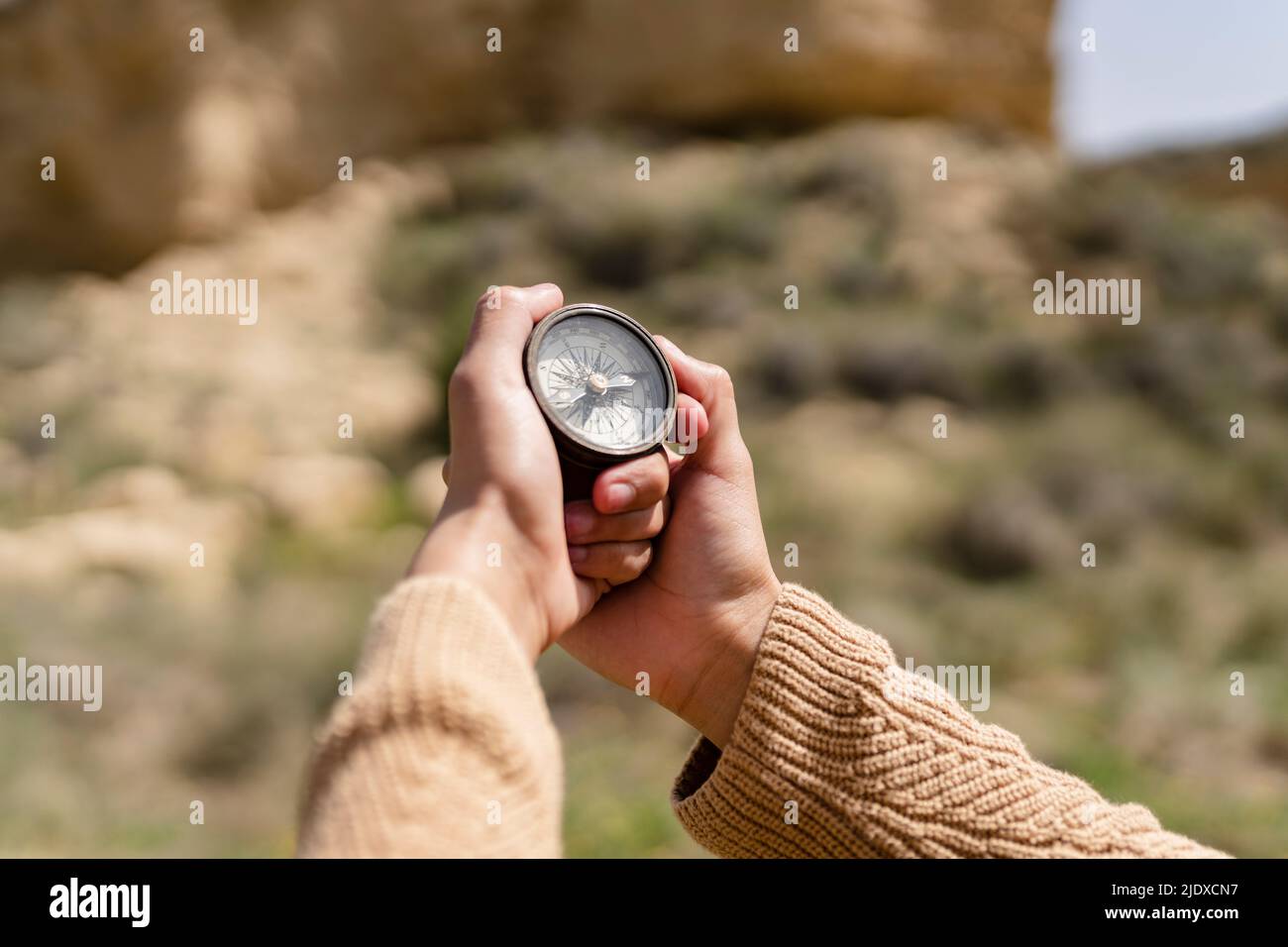 Female hand holding compass hi-res stock photography and images - Alamy