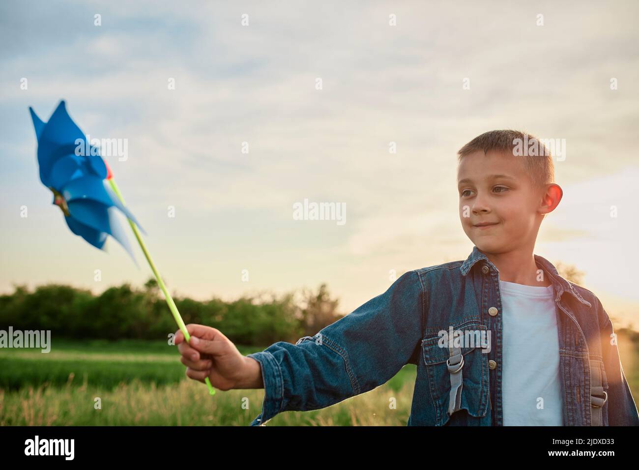 Children playing pinwheel in field hi-res stock photography and images ...