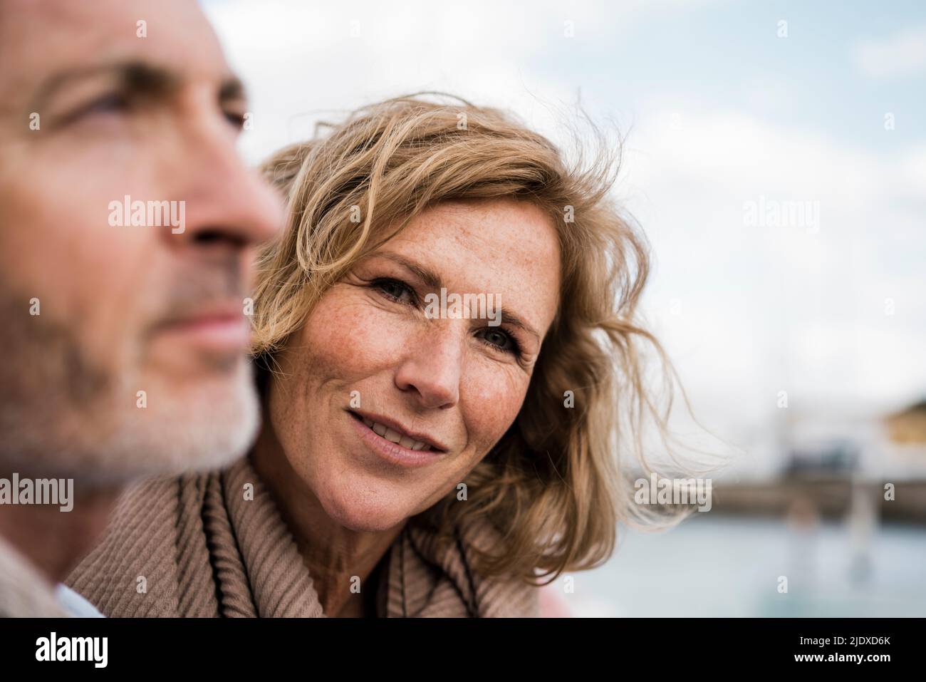 Smiling thoughtful mature woman hi-res stock photography and images - Alamy