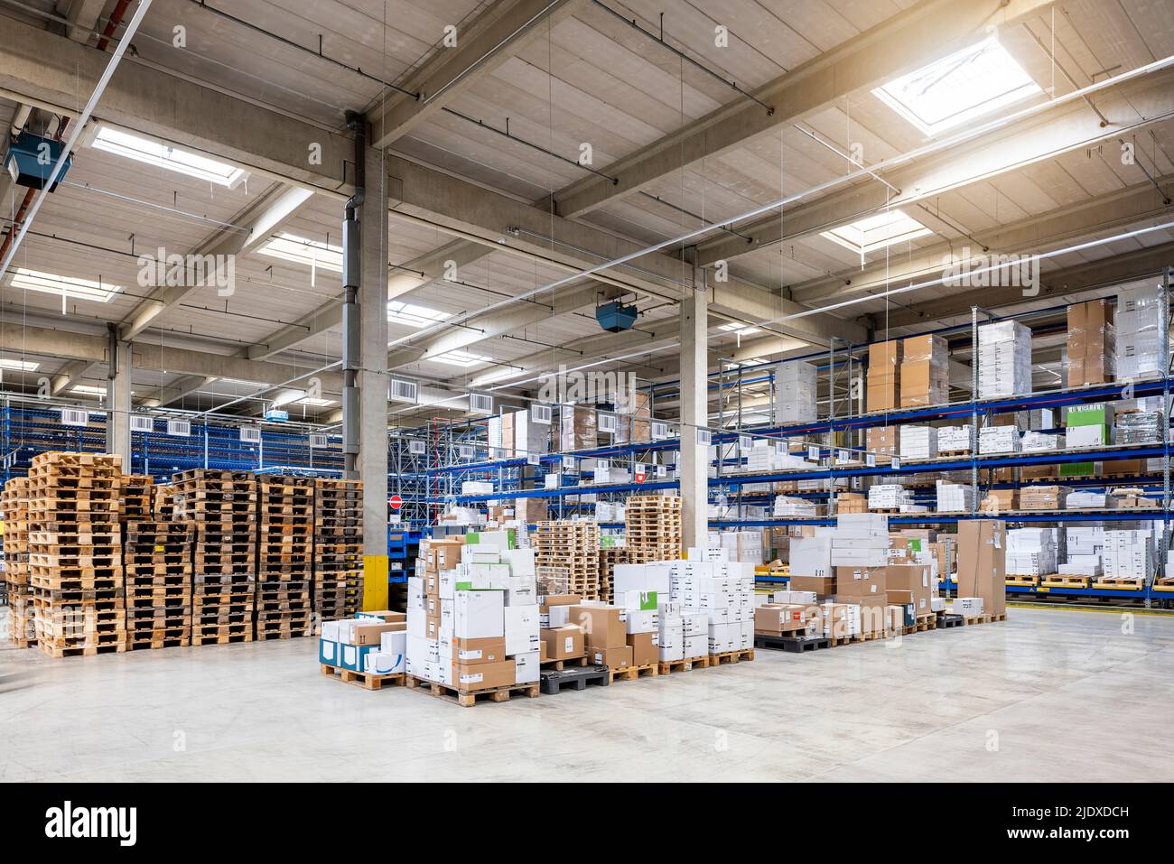 Cardboard boxes arranged in warehouse Stock Photo - Alamy