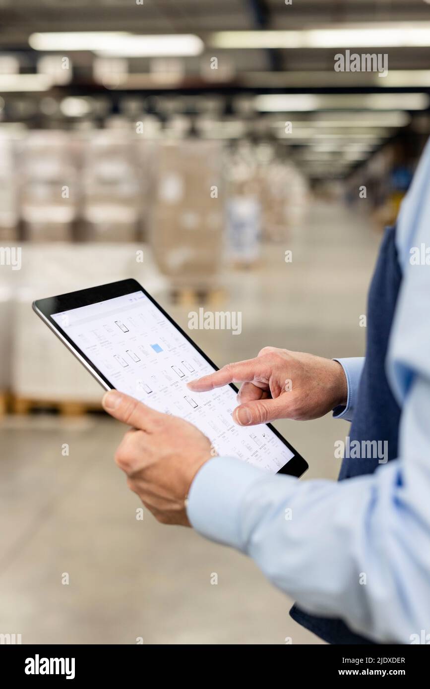 Manager checking inventory through hi-res stock photography and images ...