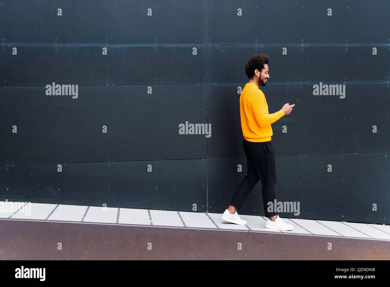 Man walking smart casual side hi-res stock photography and images - Alamy