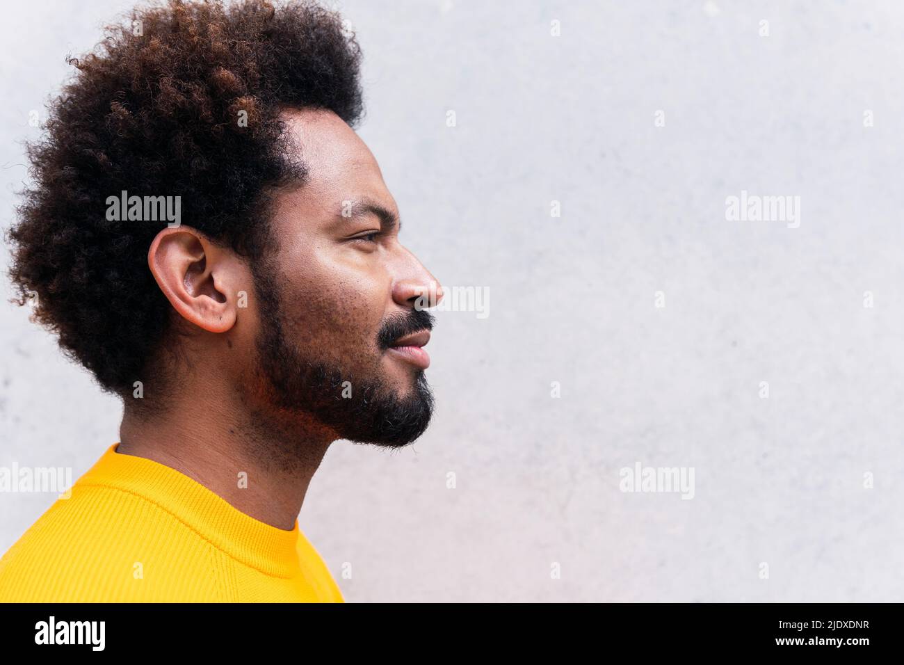 Bearded Afro man in front of white wall Stock Photo - Alamy
