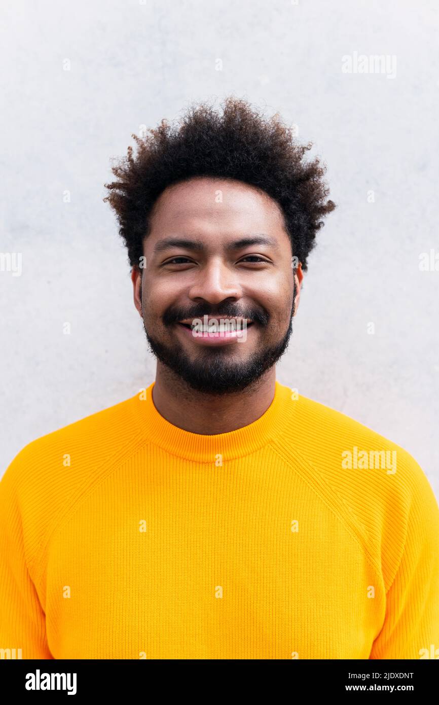 Man in yellow shirt smiling hi-res stock photography and images - Alamy