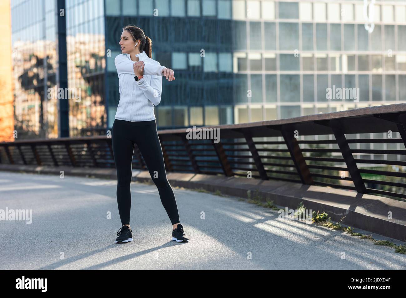Woman stretching standing bridge hi-res stock photography and images ...