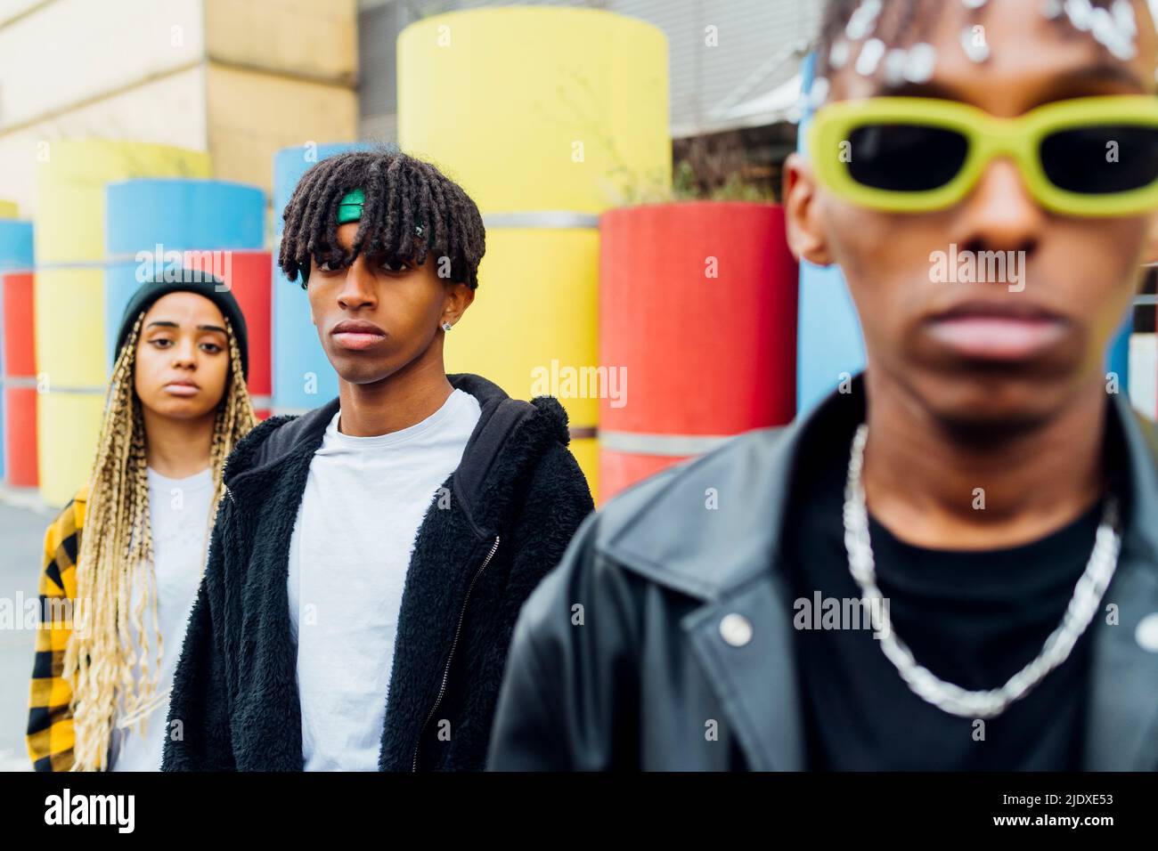 Young man with locs standing by friends Stock Photo - Alamy