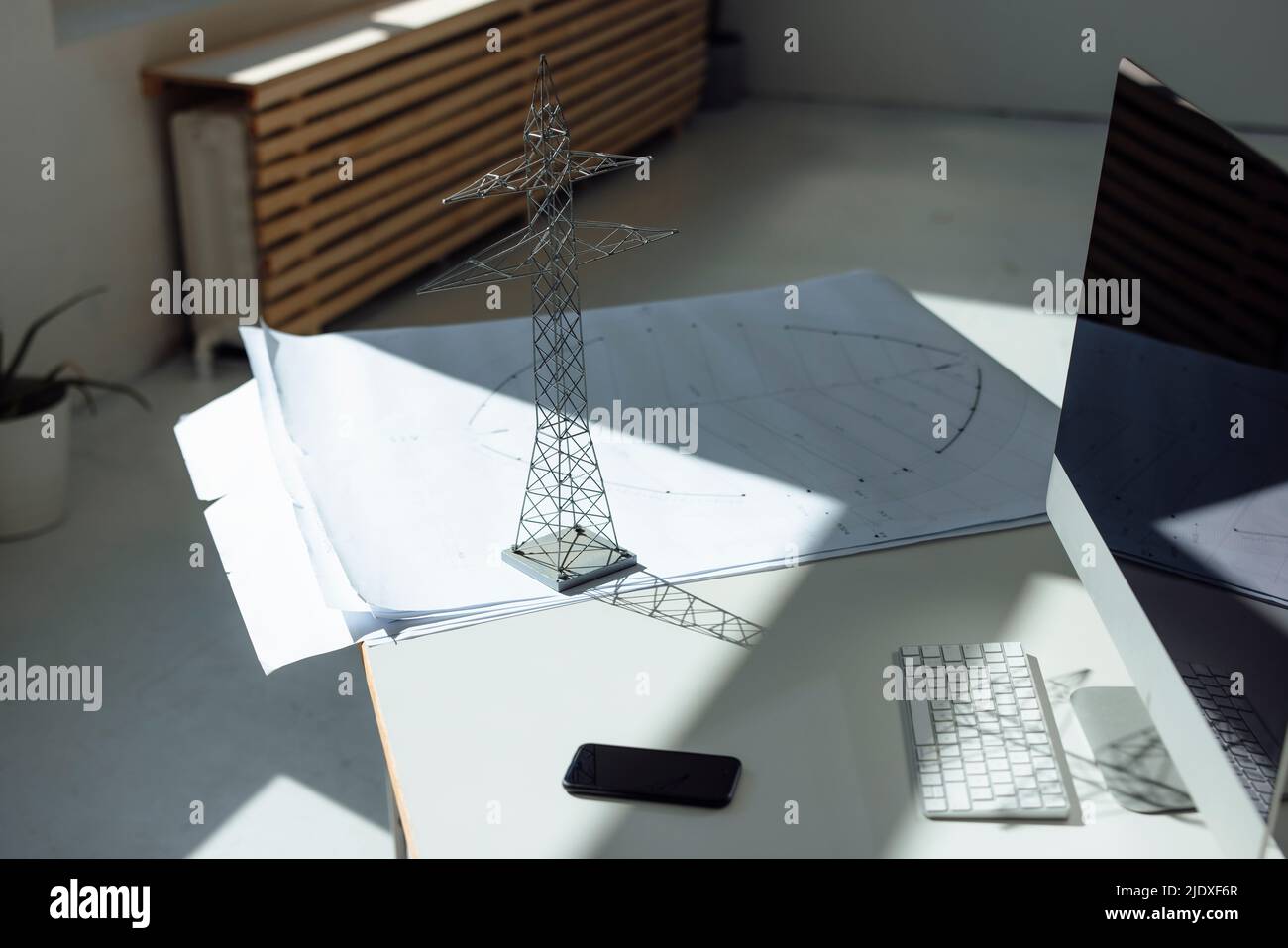 Electricity pylon model and blueprint on desk Stock Photo - Alamy