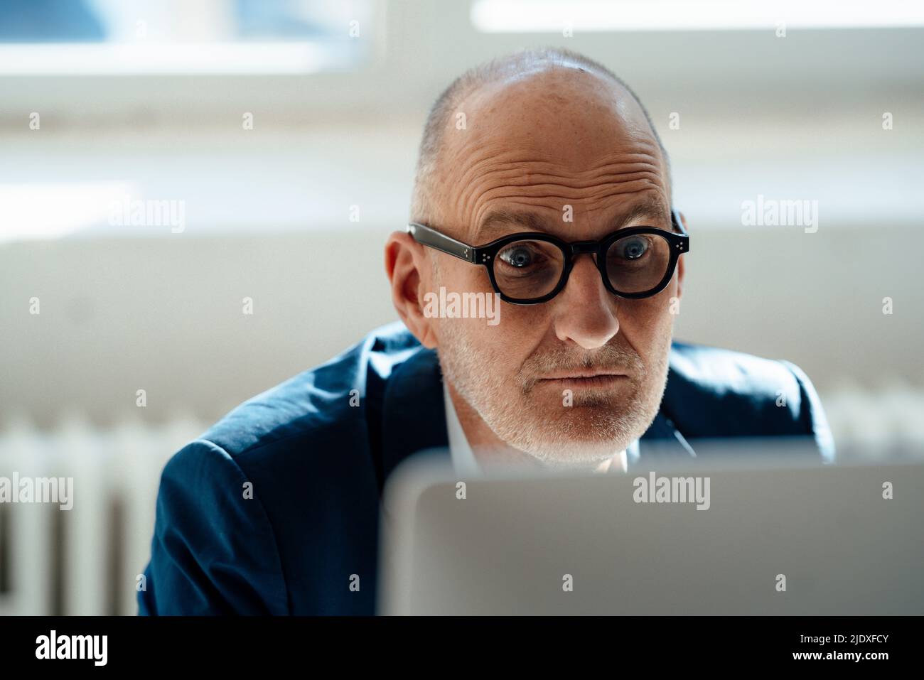 Person staring at computer screen hi-res stock photography and images ...