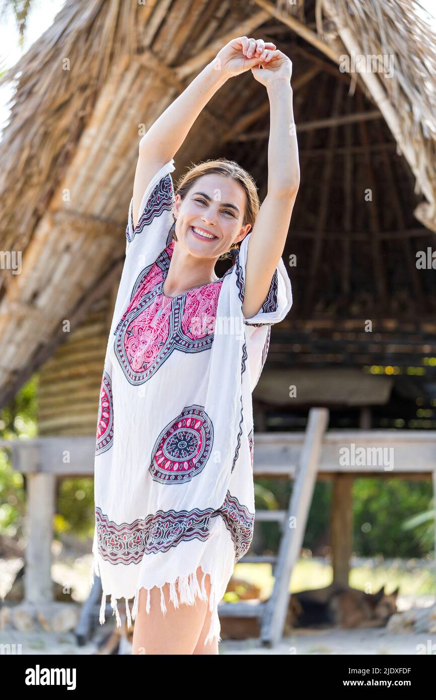 Happy woman dancing at beach on vacation Stock Photo - Alamy