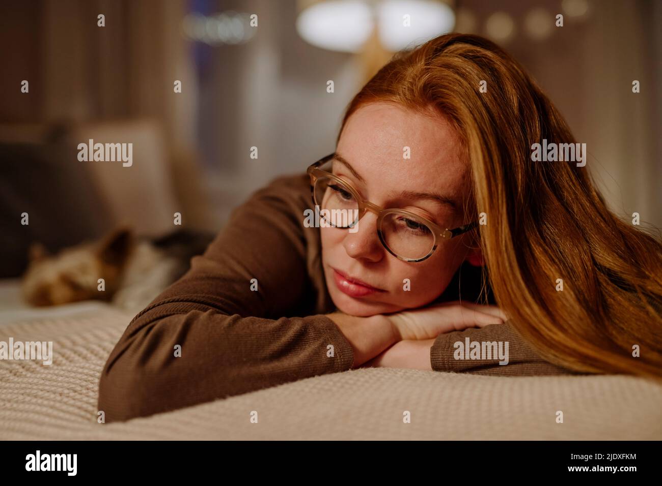 Sad woman on bed hi-res stock photography and images - Alamy