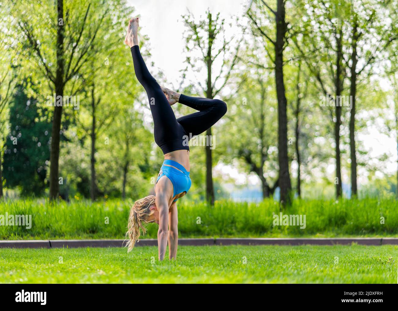 Woman practicing yoga handstand hi-res stock photography and images - Alamy