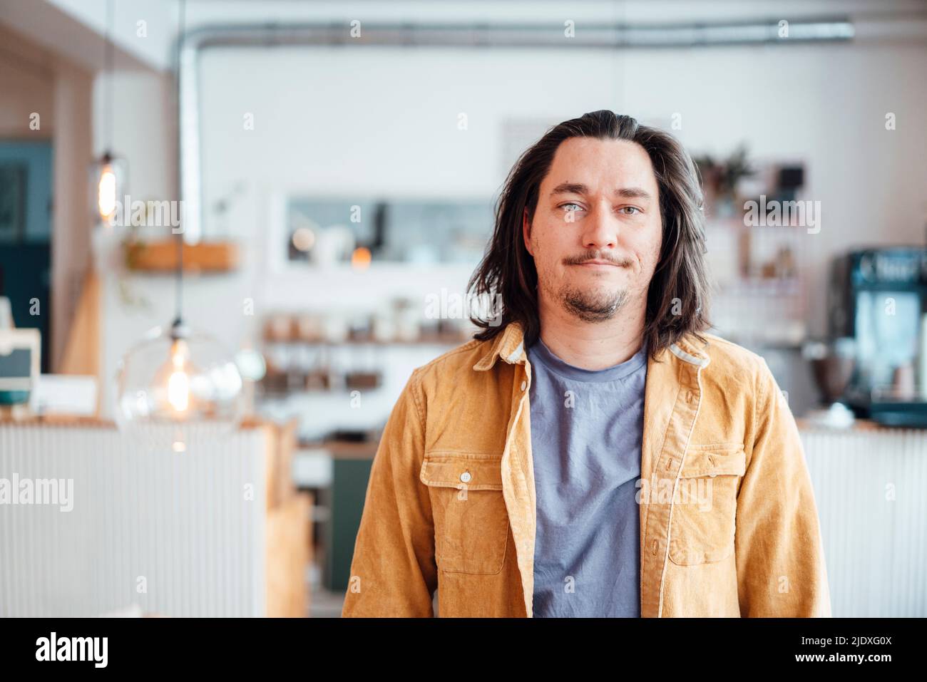Long hair man smiling hi-res stock photography and images - Alamy