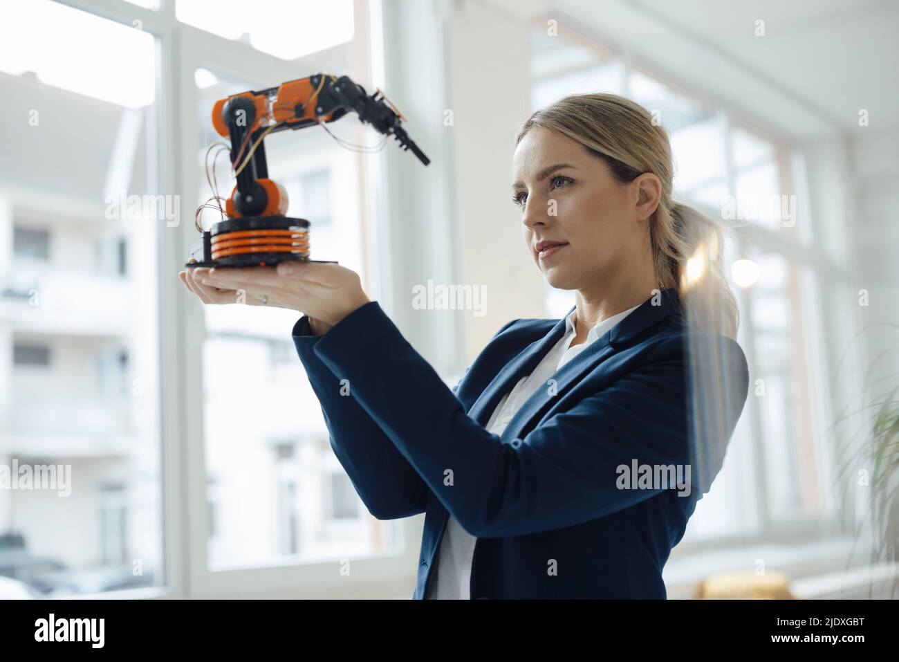 Holding her arm hi-res stock photography and images - Alamy
