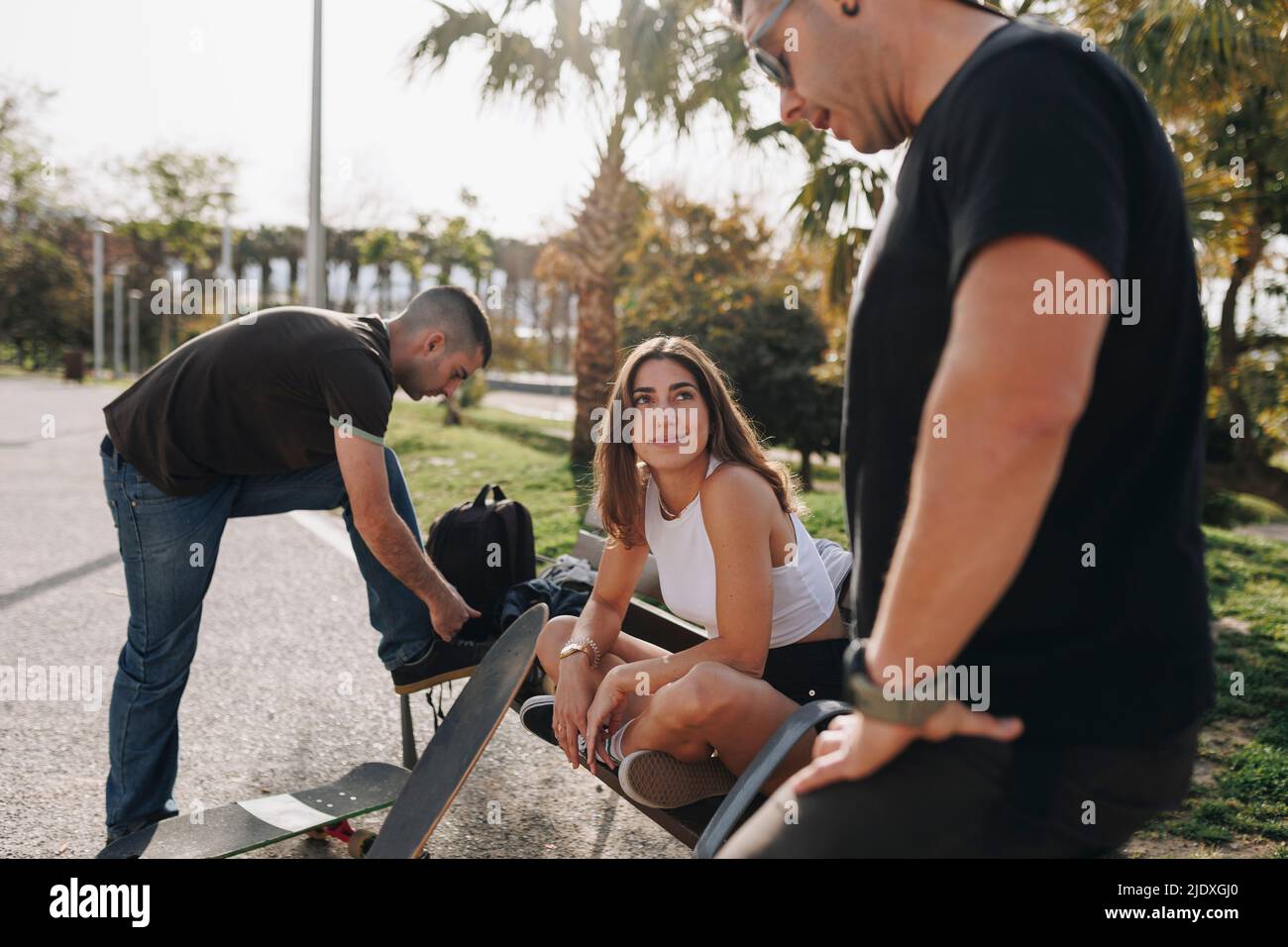 Group of young people park bench hi-res stock photography and images ...