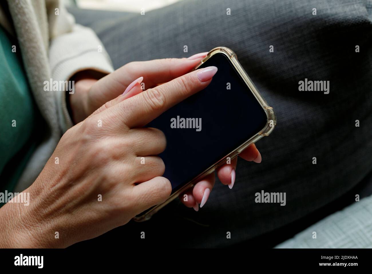 Woman touching smart phone screen Stock Photo - Alamy