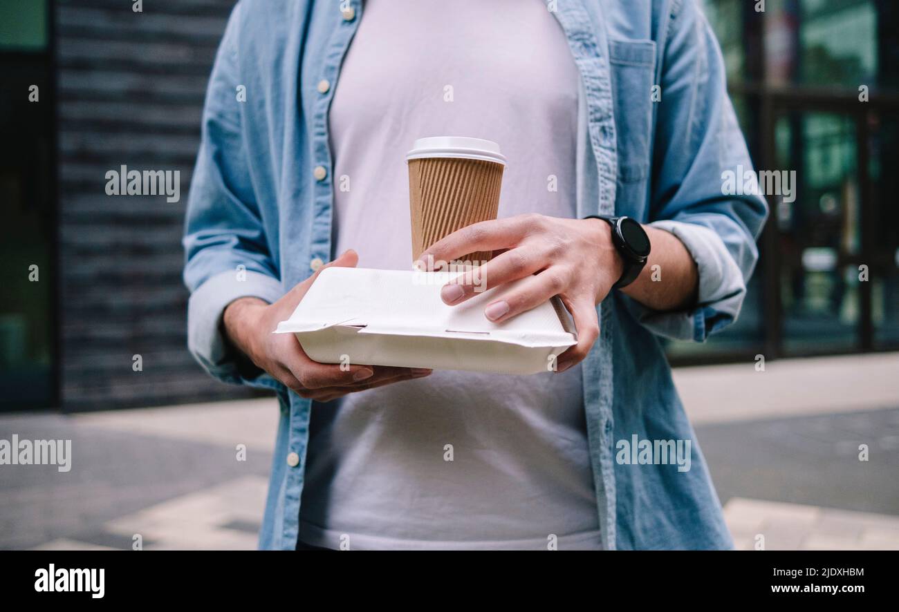 Business man holding take hi-res stock photography and images - Alamy