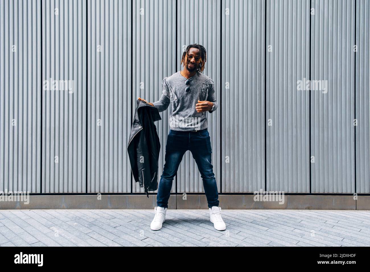 Holding his jacket hi-res stock photography and images - Alamy